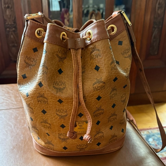 MCM | Bags | Mcm Cognac Visetos Drawstring Bucket Bag Authentic Overall ...